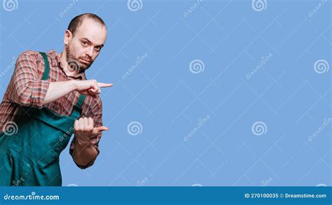 Handsome Work Man In Coveralls Pointing Questioning Something Motional Expression Stock Image
