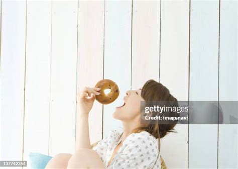 Eating Bagel Photos And Premium High Res Pictures Getty Images