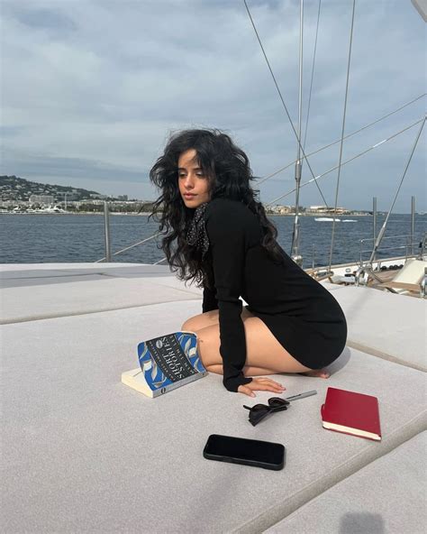 Camila Cabello Poses In Semi Sheer Blouse And Micro Shorts At The