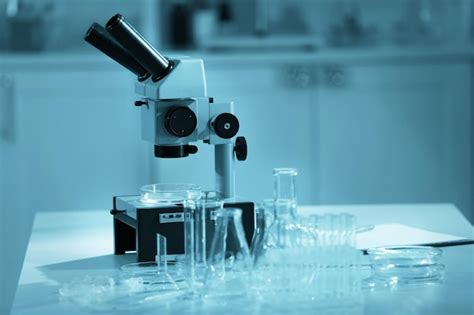 premium photo microscope and test tubes in laboratory