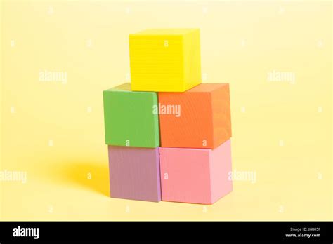 Multiple Colored Cubes On Yellow Background Stock Photo Alamy