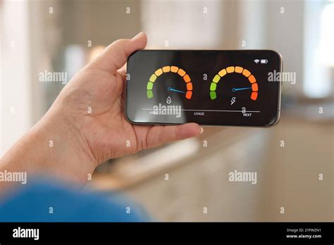 A Person Demonstrates The Use Of A Smart Device That Monitors Energy