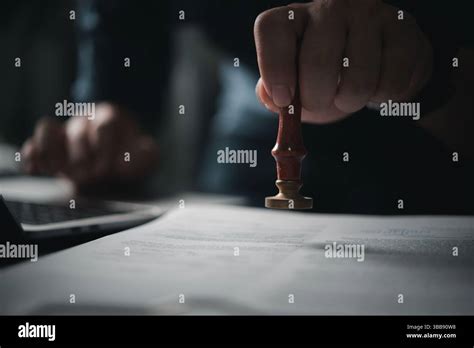 Person Using A Rubber Stamp A Document Approval Certification Or
