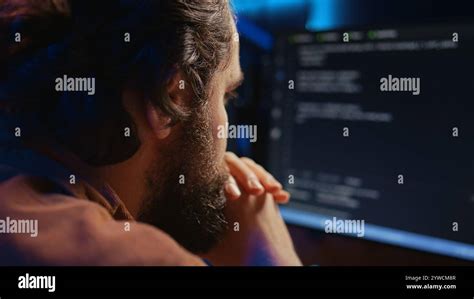 Programmer In Home Office Concentrating On Finding Bugs While Doing Coding On Computer Extreme