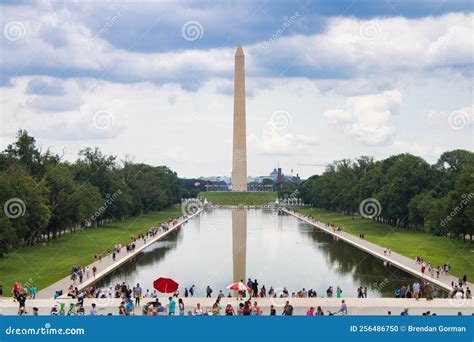 View Of The Washington Monument And Reflecting Pool On A Crowded Summer Afternoon Editorial