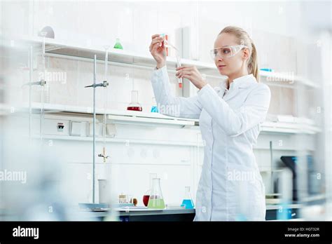 Female Trainee Working With Chemical Liquids In Lab Stock Photo Alamy