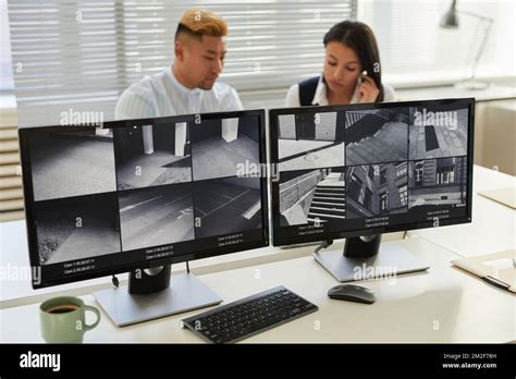 Background Image Of Two Computer Screens With Multiple Surveillance
