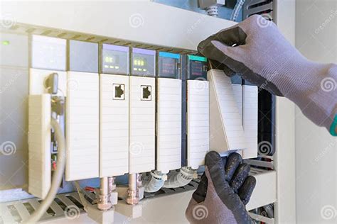 Electrical And Instrument Technician Replacing Input And Output Card Of