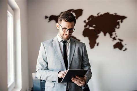 premium photo a businessman uses tablet at the office