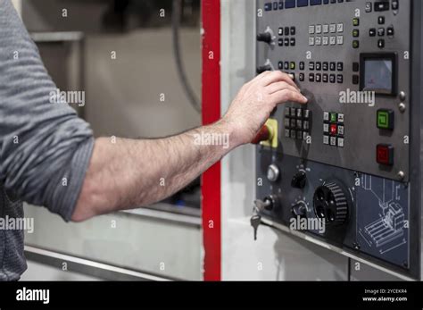 Worker Pressing Buttons On CNC Machine Control Board In Factory Graphy Stock Photo Alamy