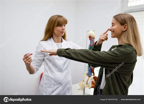 Neurologist Performing Neurological Tests Young Female Patient Doctor Checks Coordination Neurologist Performing Neurological Tests Young Female Patient Doctor Checks Coordination