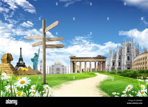 World Landmarks With Direction Panel In He Grassland With Country Road