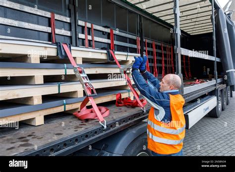 Freight Transport Professional Drivers In The Loading Zone Loading And Unloading The Truck
