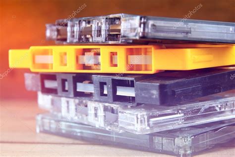 Close Up Photo Of Stack Of Cassette Tapes Over Wooden Table Retro