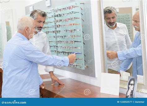 Senior Testing New Glasses With Optician Stock Image Image Of Adult