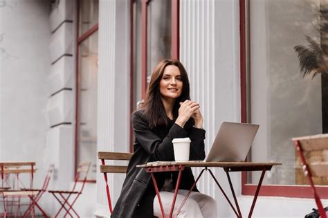 Premium Photo Attractive Girl Programmer With Laptop Is Working