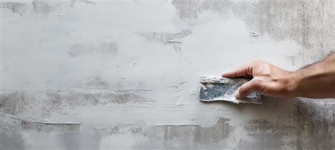 Premium Photo Construction Workers Hands Applying Plaster Skill In Action