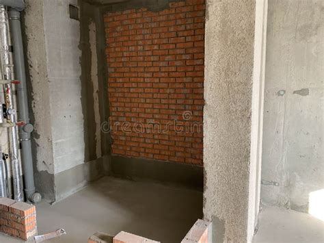 The Apartment Is In A New Building Without Repair Brick Walls Stock