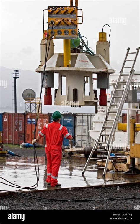 Engineer Supervising Installation Of Tree Running Tool Part Of Oil Rig Well Head To Test Stump Engineer Supervising Installation Of Tree Running Tool Part Of Oil Rig Well Head To Test Stump