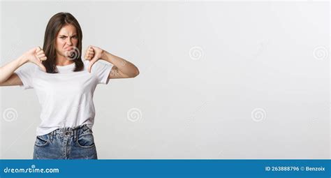 Guy Express Big Dislike Showing Thumbs Down And Stick Tongue From