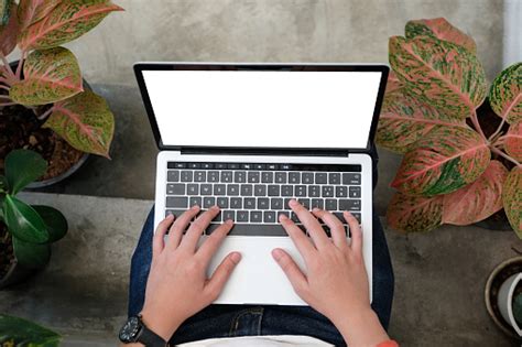 Man Hands Typing Laptop Computer With Blank Screen For Mock Up Template