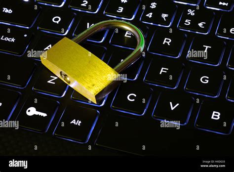 Closed Lock And Key Button On A Backlit Computer Keyboard Stock Photo Alamy
