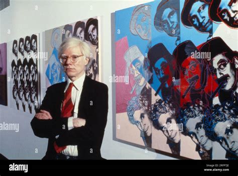 Andy Warhol In A Ny Gallery With His Art Portraits In 1975 Warhol Was