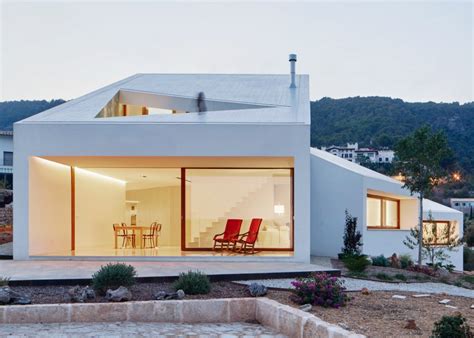four angular white volumes form house in mallorca by ohlab
