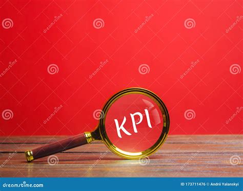 Magnifying Glass With The Inscription KPI Key Performance Indicator Planning And Implementing