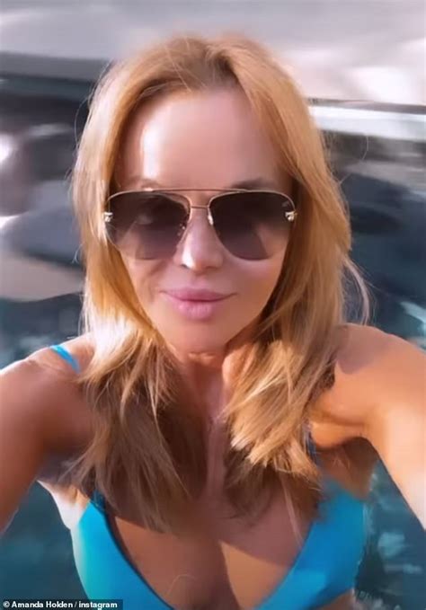 Amanda Holden Stuns In A Plunging Blue Bikini While Enjoying A Dip In