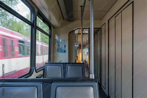 Interior View Of A Corridor Inside Passenger Trains With Old Grey Seats