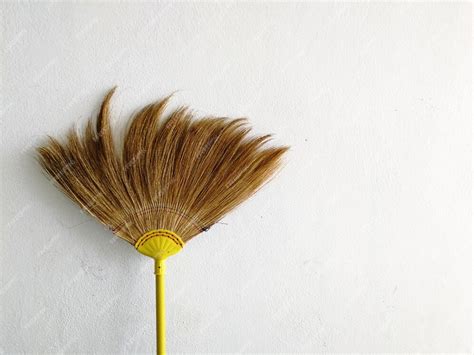 Premium Photo Close Up Of Broom Against White Wall
