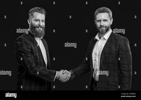 Cheerful Men Deal With Handshake On Background Photo Of Men Deal With