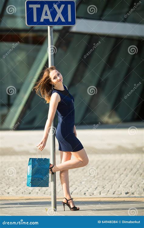 Young Fashionable Girl With Shopping Waiting For Taxi Happy Stock