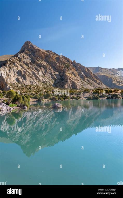 The Pamir Range View And Peaceful Campsite On Kulikalon Lake In Fann