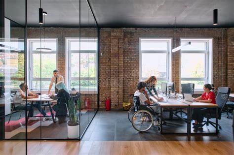 A Diverse Group Of Business Professionals Collaborates In A Modern