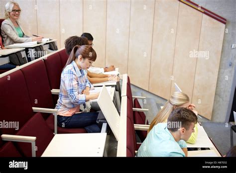 Group Of Students With Notebooks At Lecture Hall Stock Photo Alamy