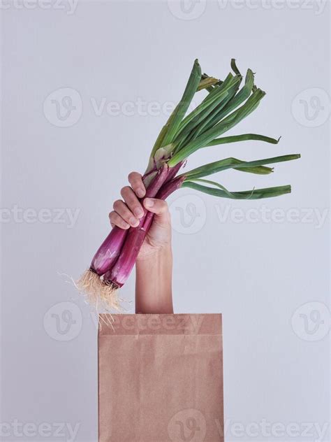 Crop Female Hand With Red Leek Showing From Paper Bag 58788287 Stock