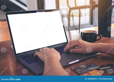 Mockup Image Of Hands Typing On Laptop Keyboard With Blank White Screen And Credit Cards Royalty