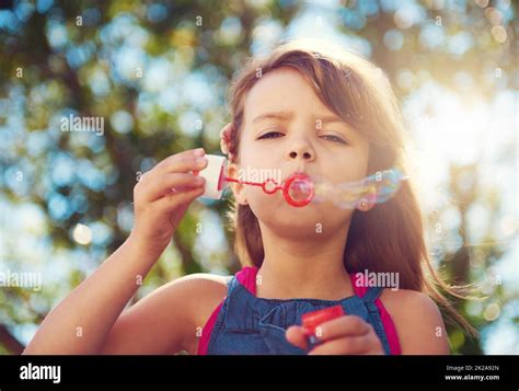 Keep Calm And Blow Bubbles Shot Of A Cute Young Girl Blowing Bubbles