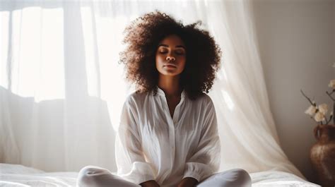 Premium Photo There Is A Woman Sitting On A Bed With Her Eyes Closed