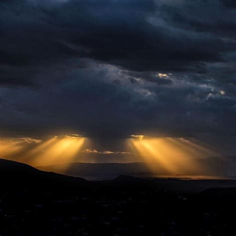 Sunlight Through Dark Clouds