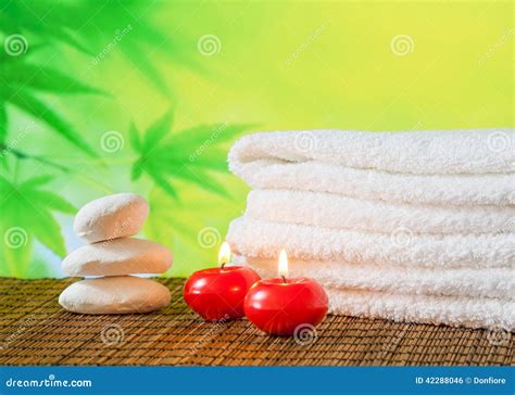 Spa Massage Border Background With Towel Stackedred Candles And Stone