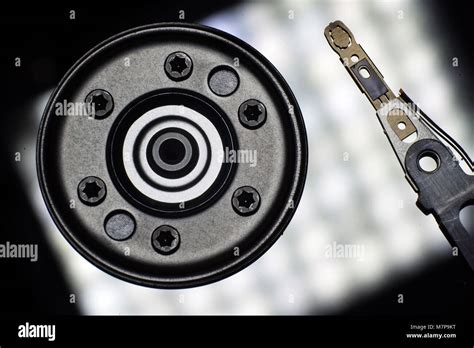 Internal View Of Computer Laptop Hard Drive Showing Read Write Head And Magnetic Disk Stock