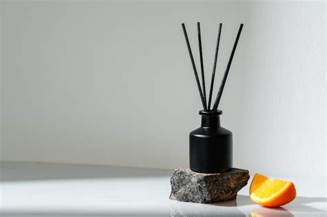 Premium Photo Aromatic Reed Diffuser On A Stone Base With Orange