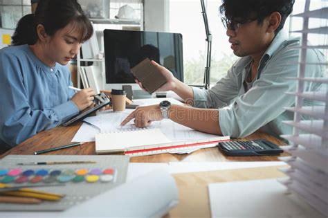 Architects And Interior Designers Woman Discussing About Concept Of Building Design Estimation