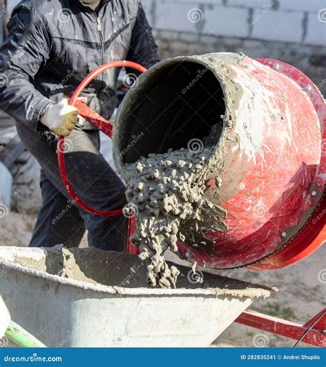 Worker Pouring Concrete With Cement Mixer At Construction Site Closeup Stock Image Image Of