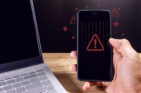 Premium Photo Man Holding A Smartphone With Red Triangle Caution Warning Sign For Notification