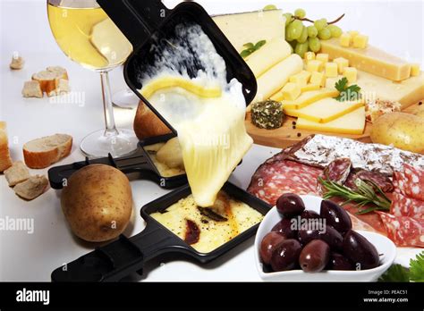 Delicious Traditional Swiss Melted Raclette Cheese On Diced Boiled Or