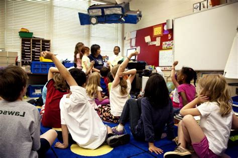 Free Picture Male Student Holding Book Sitting Classmates